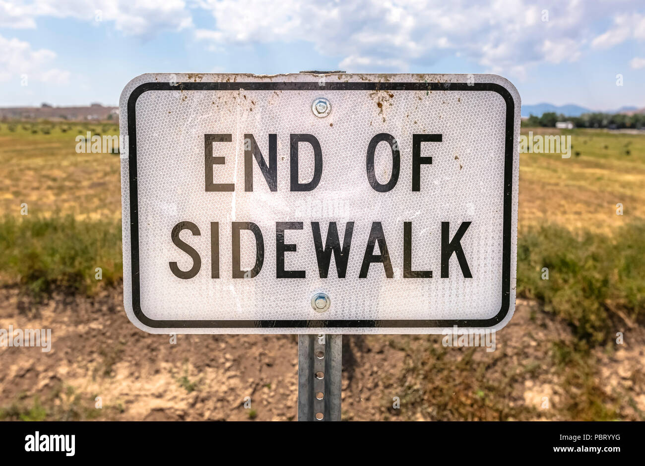 End of sidewalk sign straight on Stock Photo - Alamy