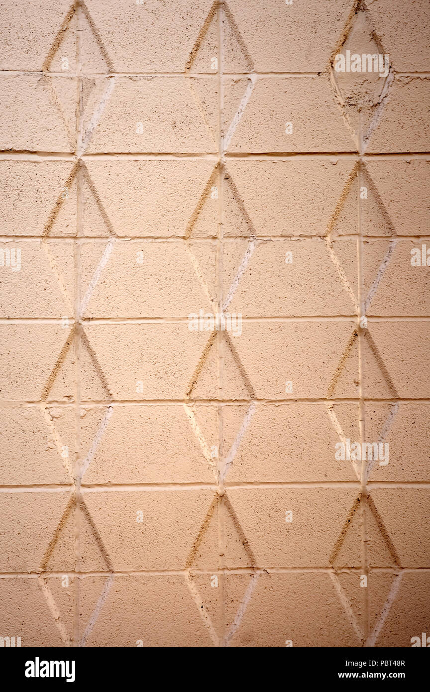 Tan colored concrete or cement wall with diamond pattern Stock Photo ...