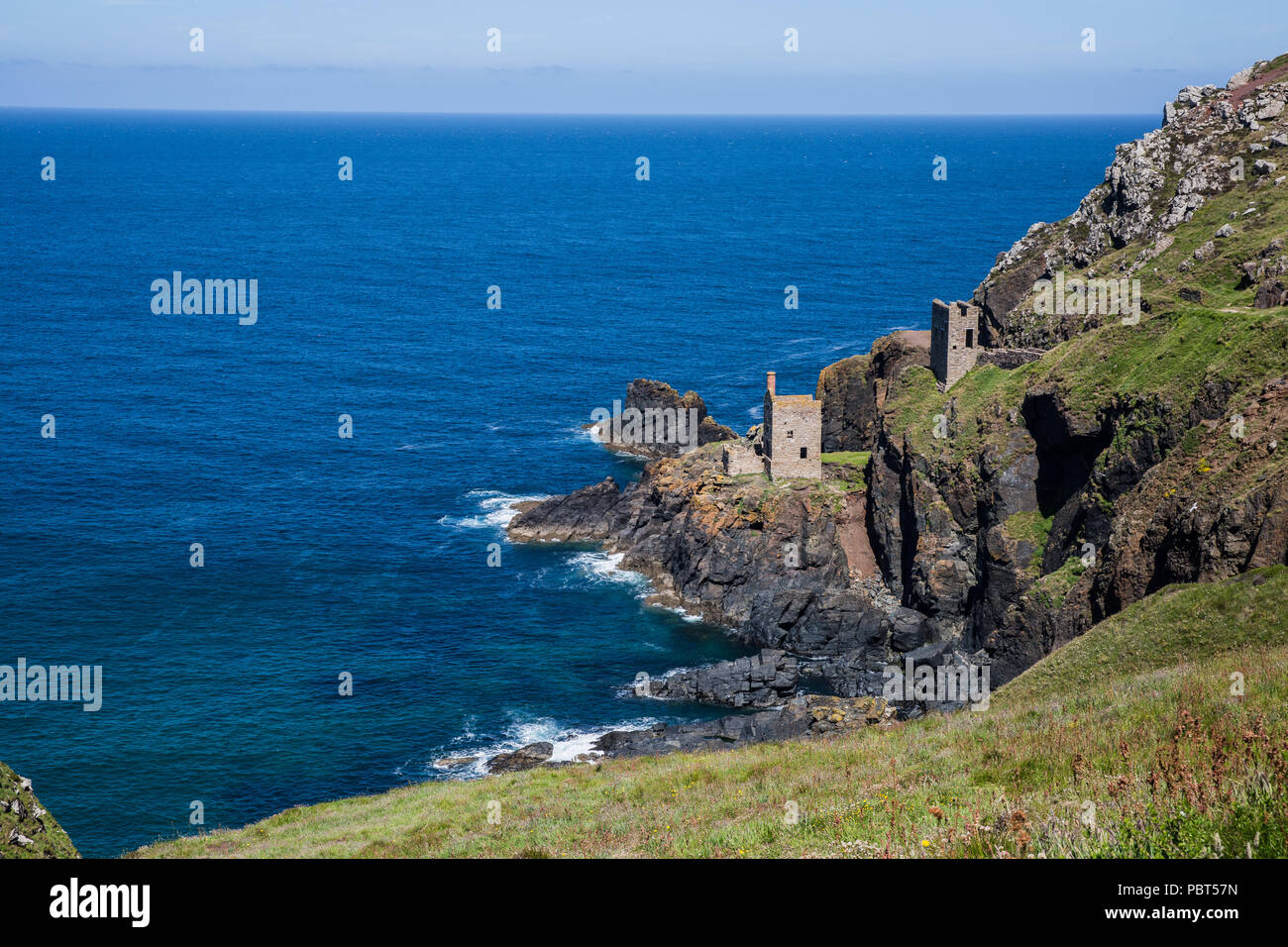 The derelict buildings of abandoned Cornish tin mines overlooking the ...