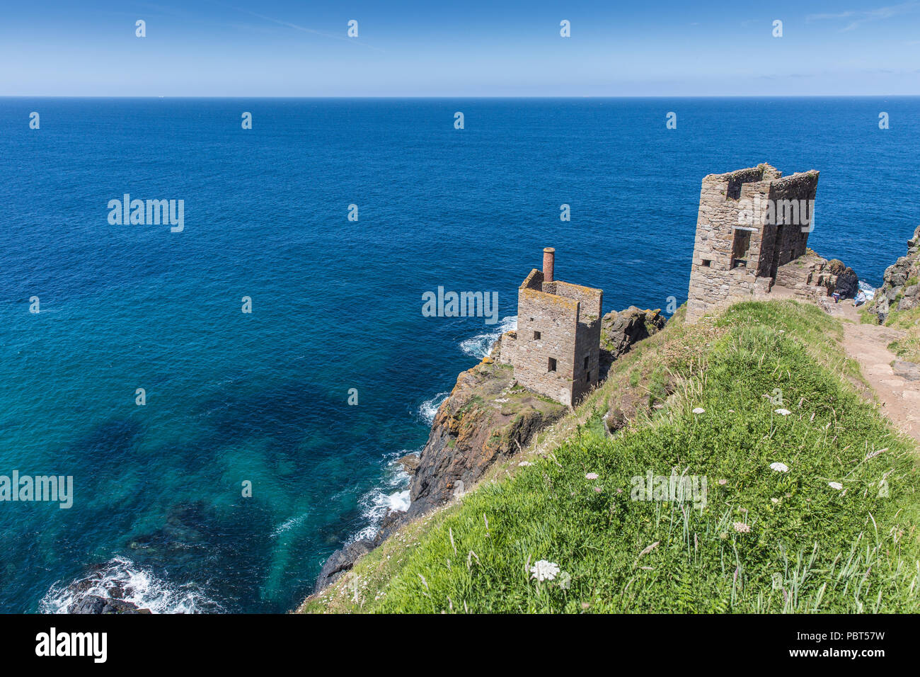 The derelict buildings of abandoned Cornish tin mines overlooking the ...