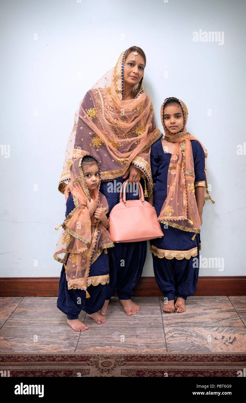 A mother & two daughters dressed alike at a Sikh wedding in Richmond ...