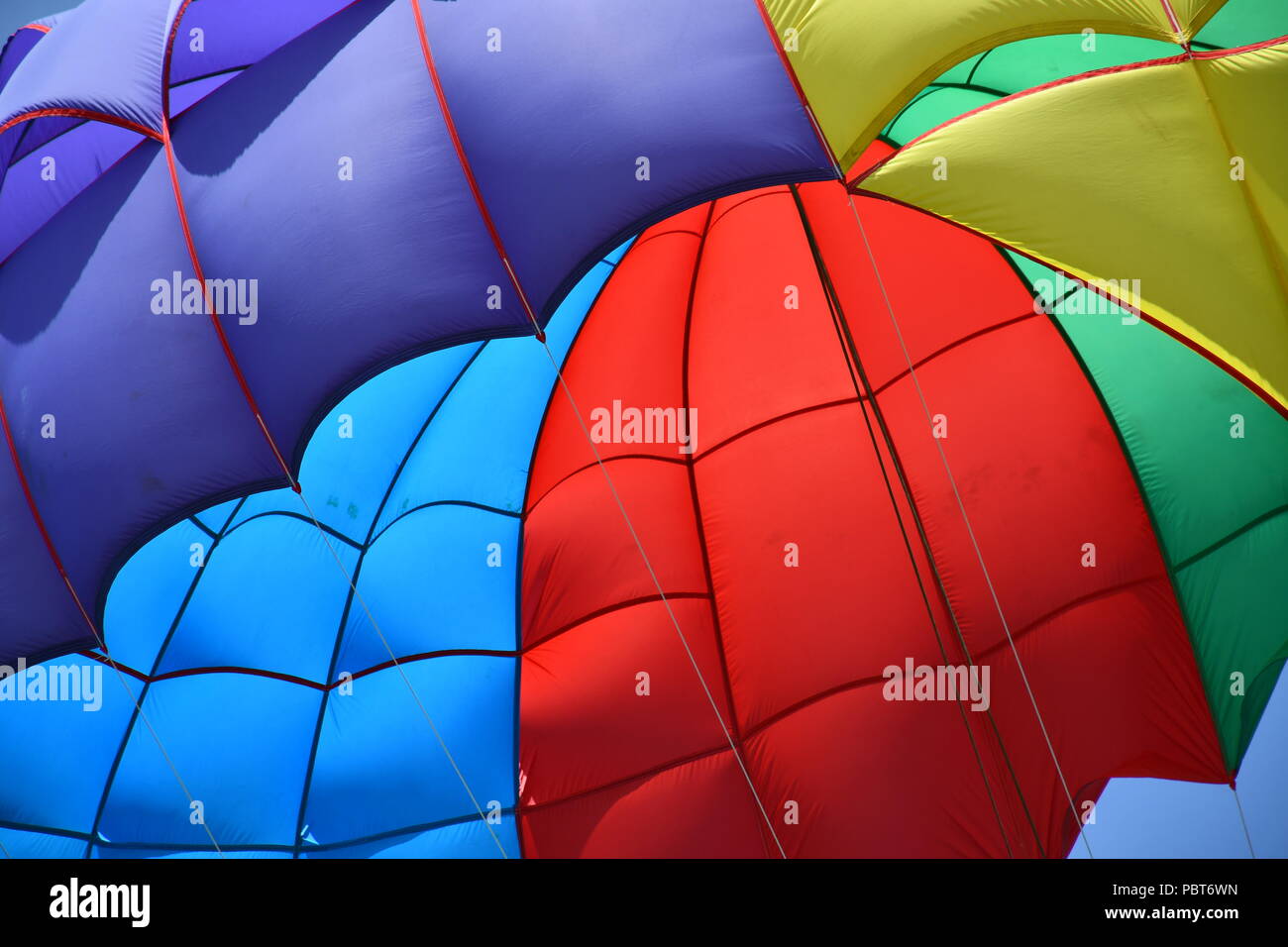 Close up shot of para-sail on lit by a bright sun Stock Photo - Alamy