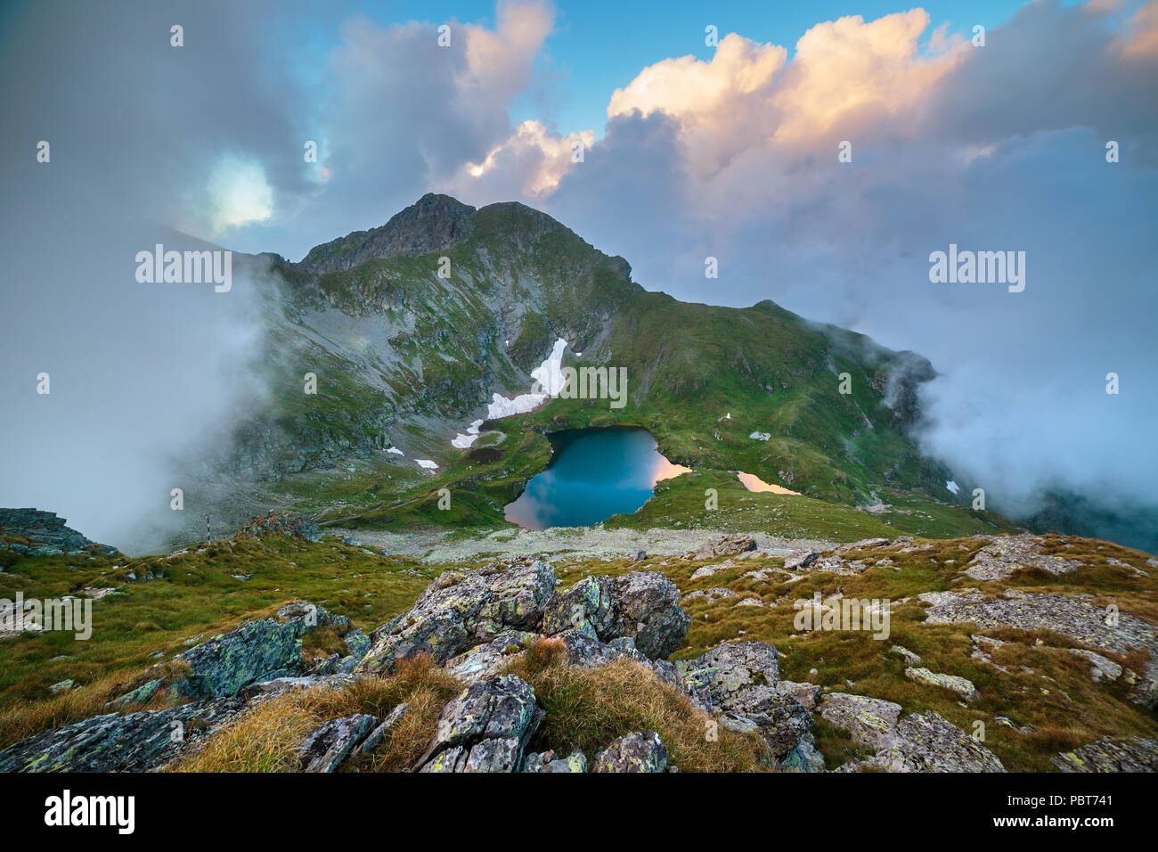 Landscape with glacial lake Capra in Fagaras mountains, Romania Stock ...