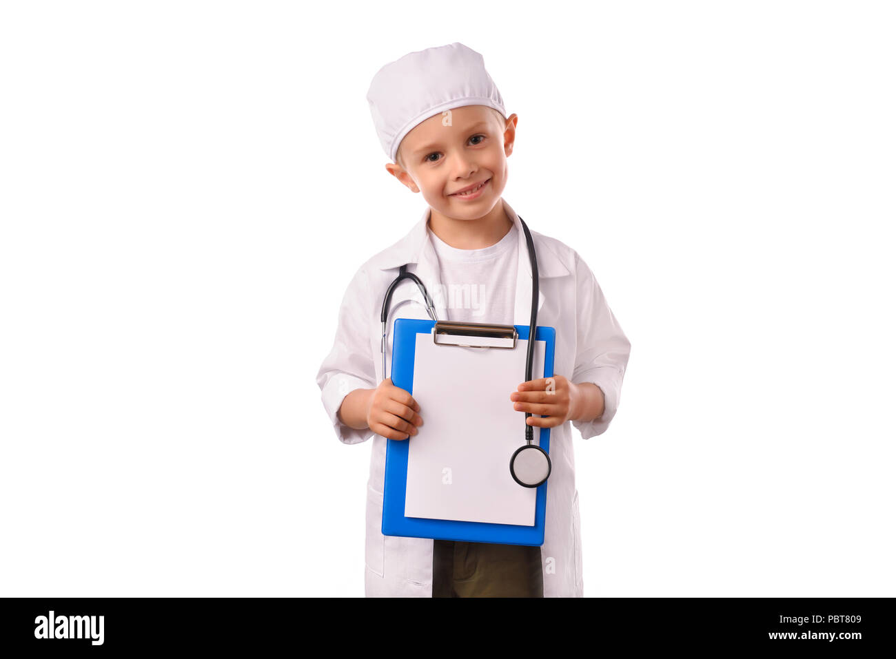A little, smiling boy doctor in medical uniform, isolated on white ...