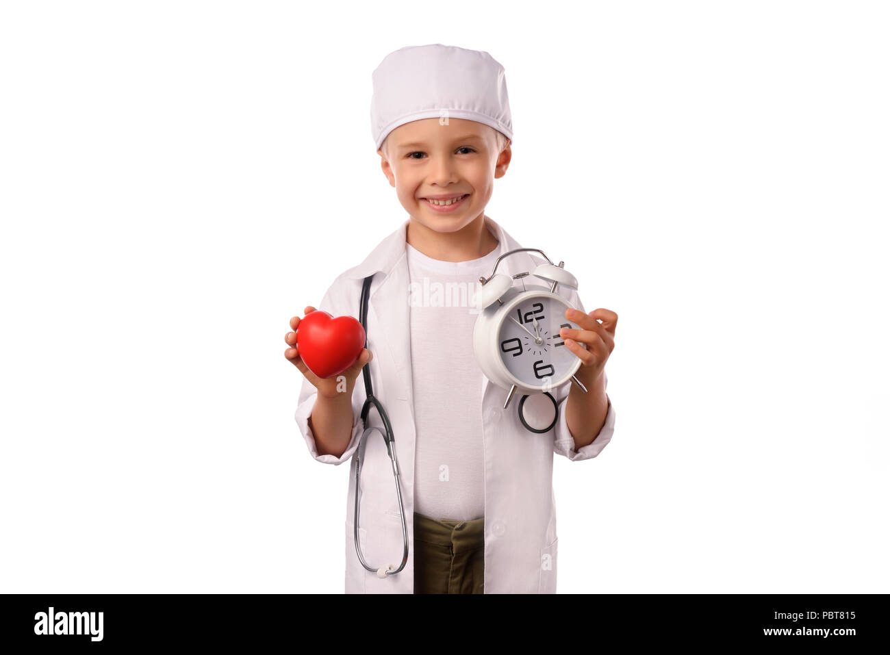 A little, smiling boy doctor in medical uniform, isolated on white ...