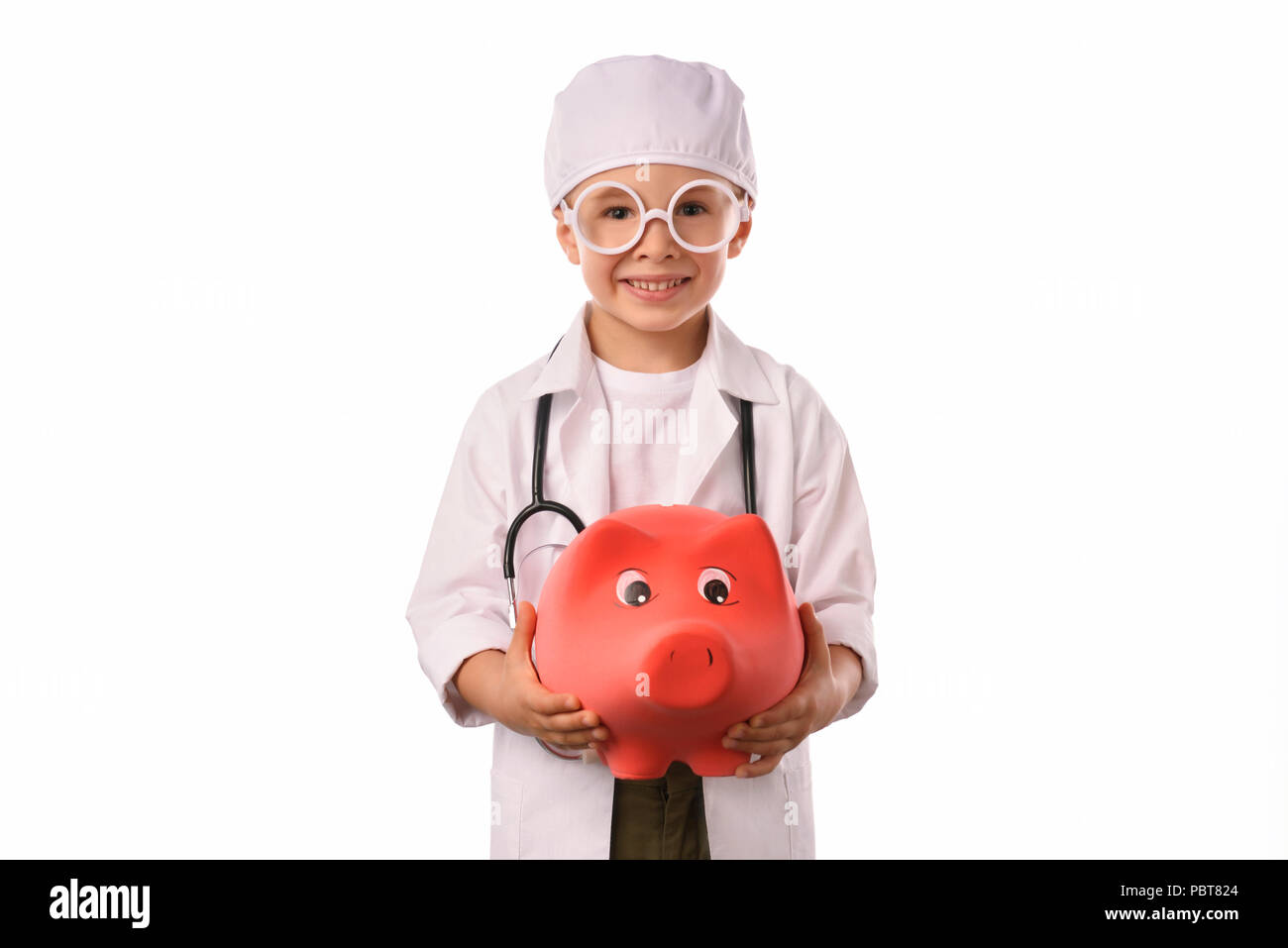A little, smiling boy doctor in medical uniform, isolated on white ...