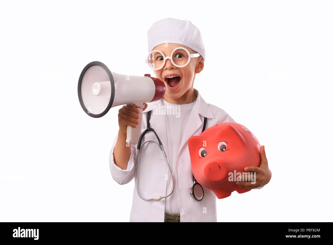 A little, smiling boy doctor in medical uniform, isolated on white ...