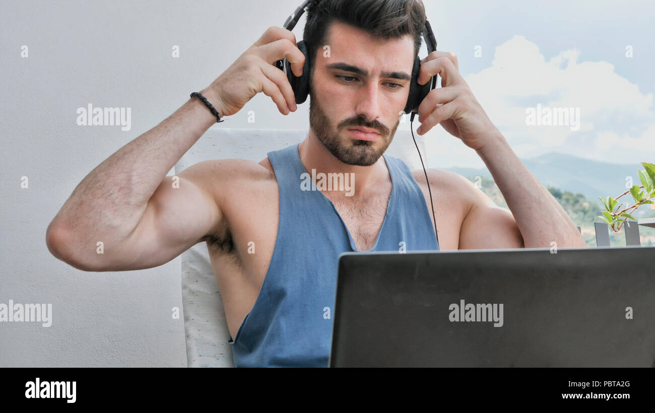 Waist Up Profile of Attractive Man with Dark Hair, Sitting with Laptop ...