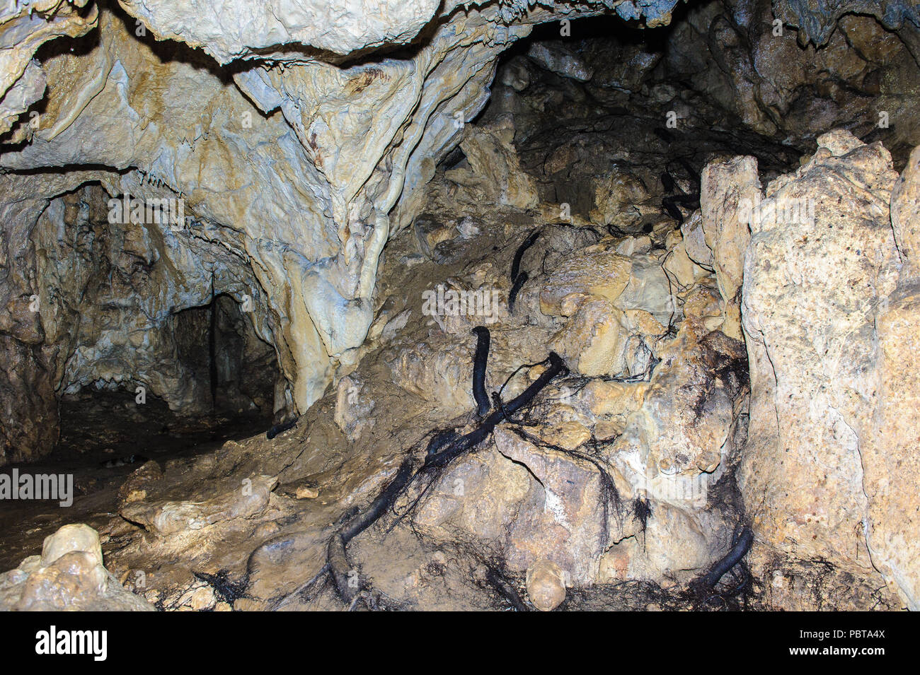 Inside of a cave, its brown stone walls Stock Photo - Alamy
