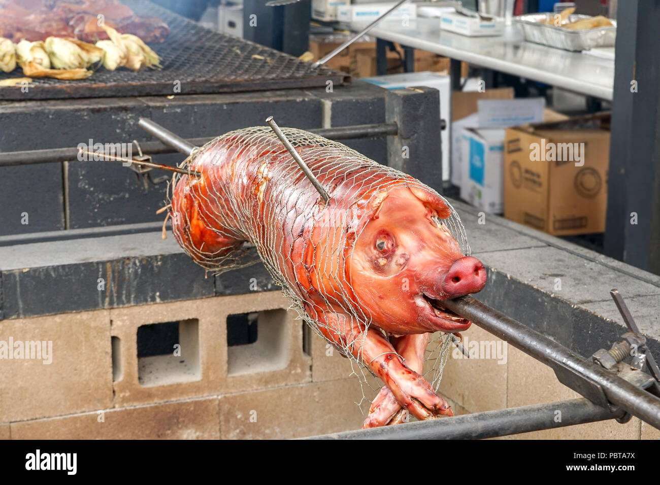 Pig on spit hi-res stock photography and images - Alamy