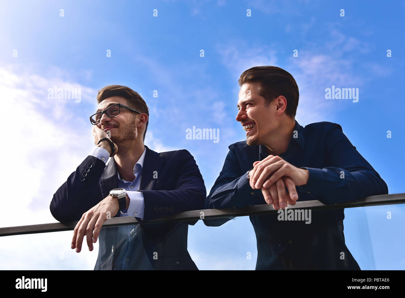 wo awesome business man have a rest between a work. Speak easy Stock ...