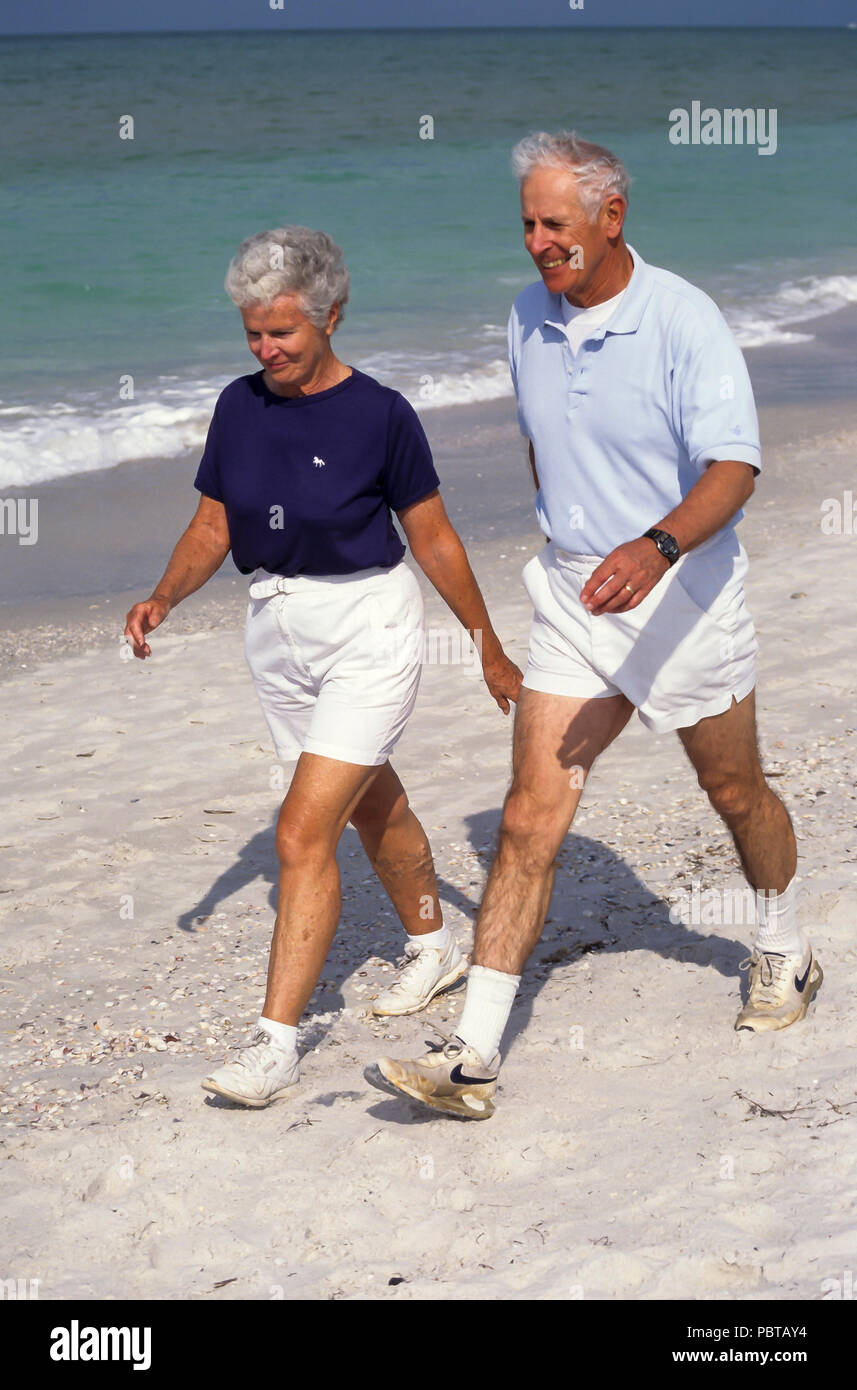 Senior couple power walking on beach MR © Myrleen Pearson ..Ferguson ...