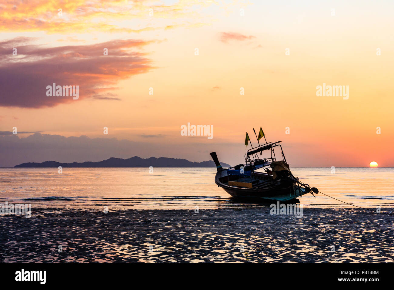 Long tail boat at sunset, Pak Meng beach, Trang, Thailand Stock Photo ...
