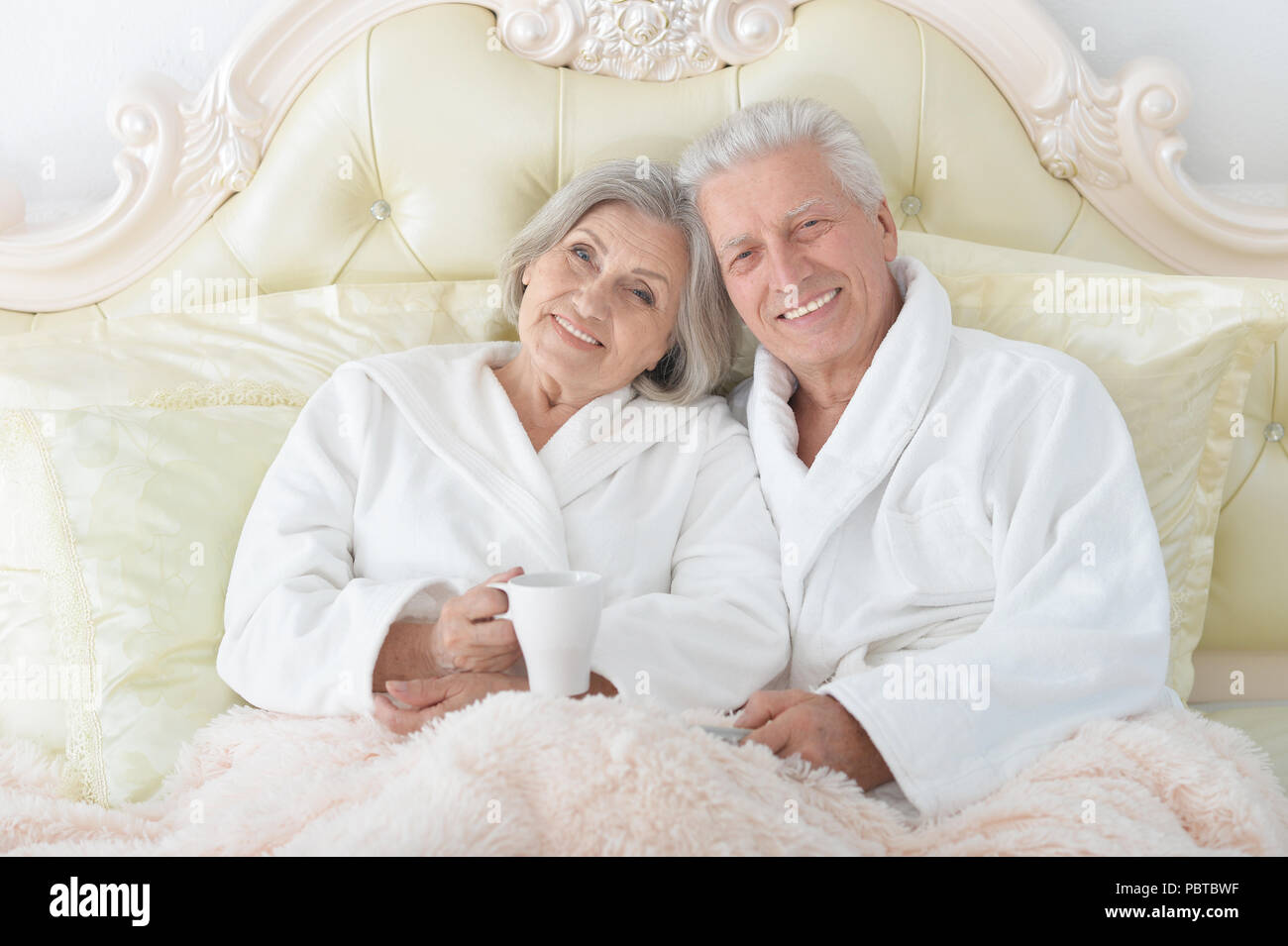 Attractive mature couple in bed hi-res stock photography and images - Alamy