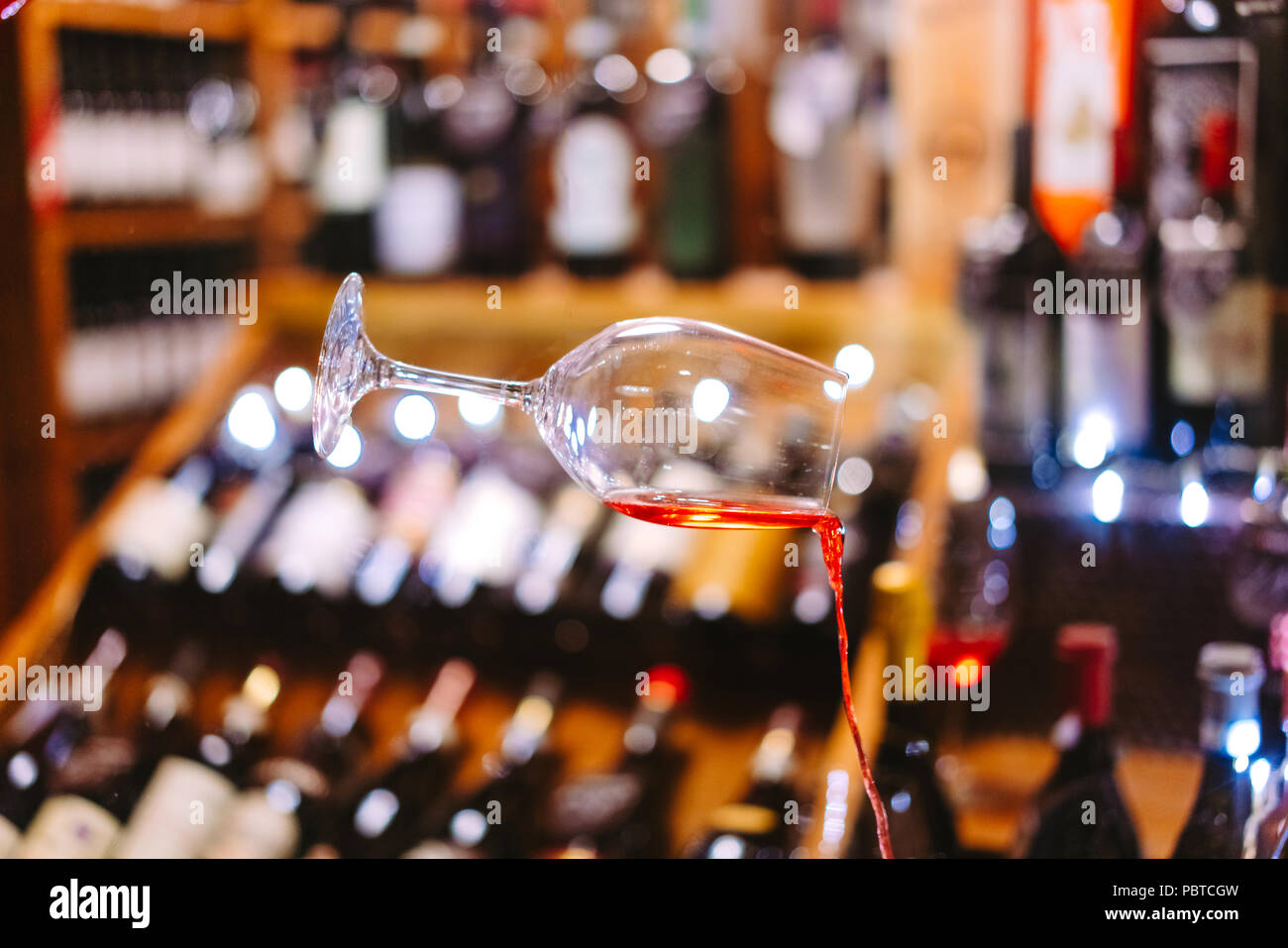 Glass of Wine Falling Mid Air with Spill Stock Photo - Alamy