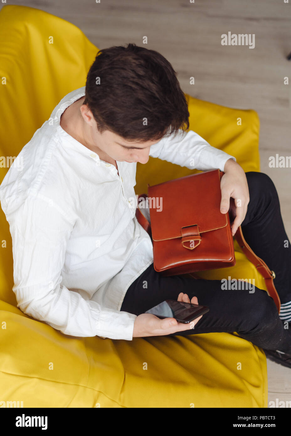 Handsome guy leather bag hi-res stock photography and images - Alamy
