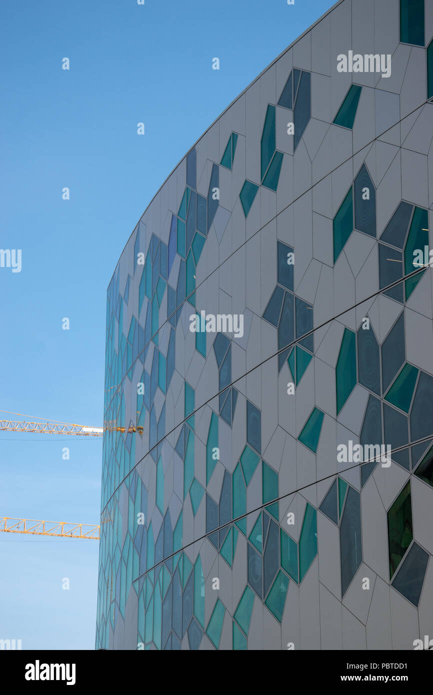 Exterior of the New Calgary Central Library. The exterior is a textured ...