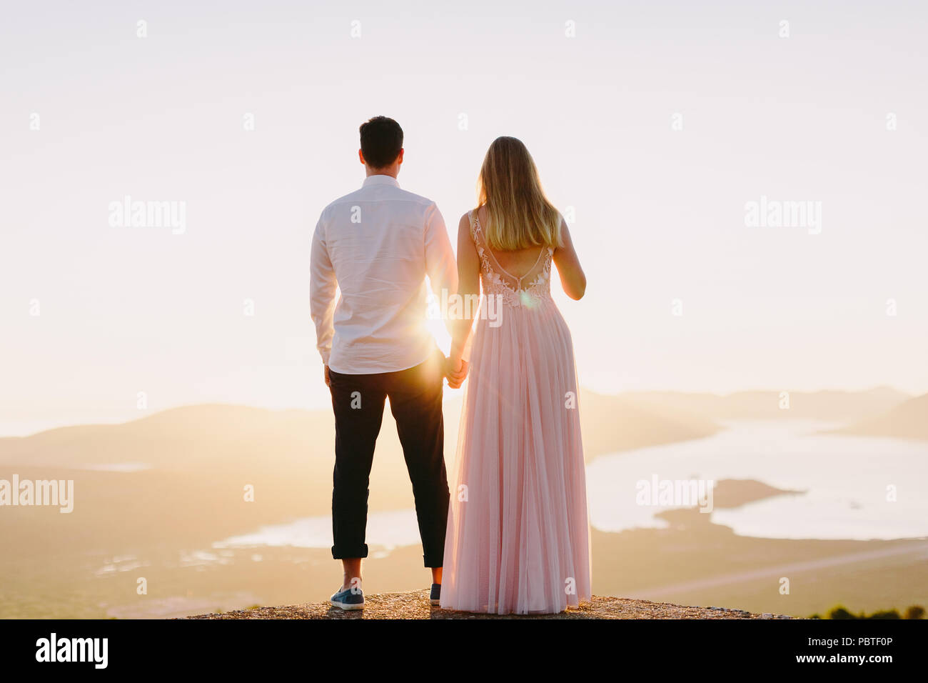 couple relax at sunset with beautiful view. Sun and horizon view ...