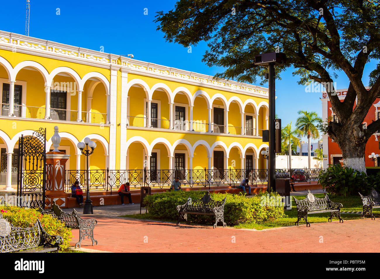 Yellow building of the main square (Zocalo) of Palenque, Mexico Stock ...