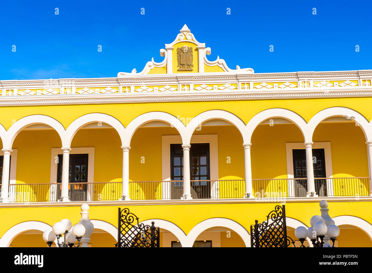 Yellow building of the main square (Zocalo) of Palenque, Mexico Stock ...