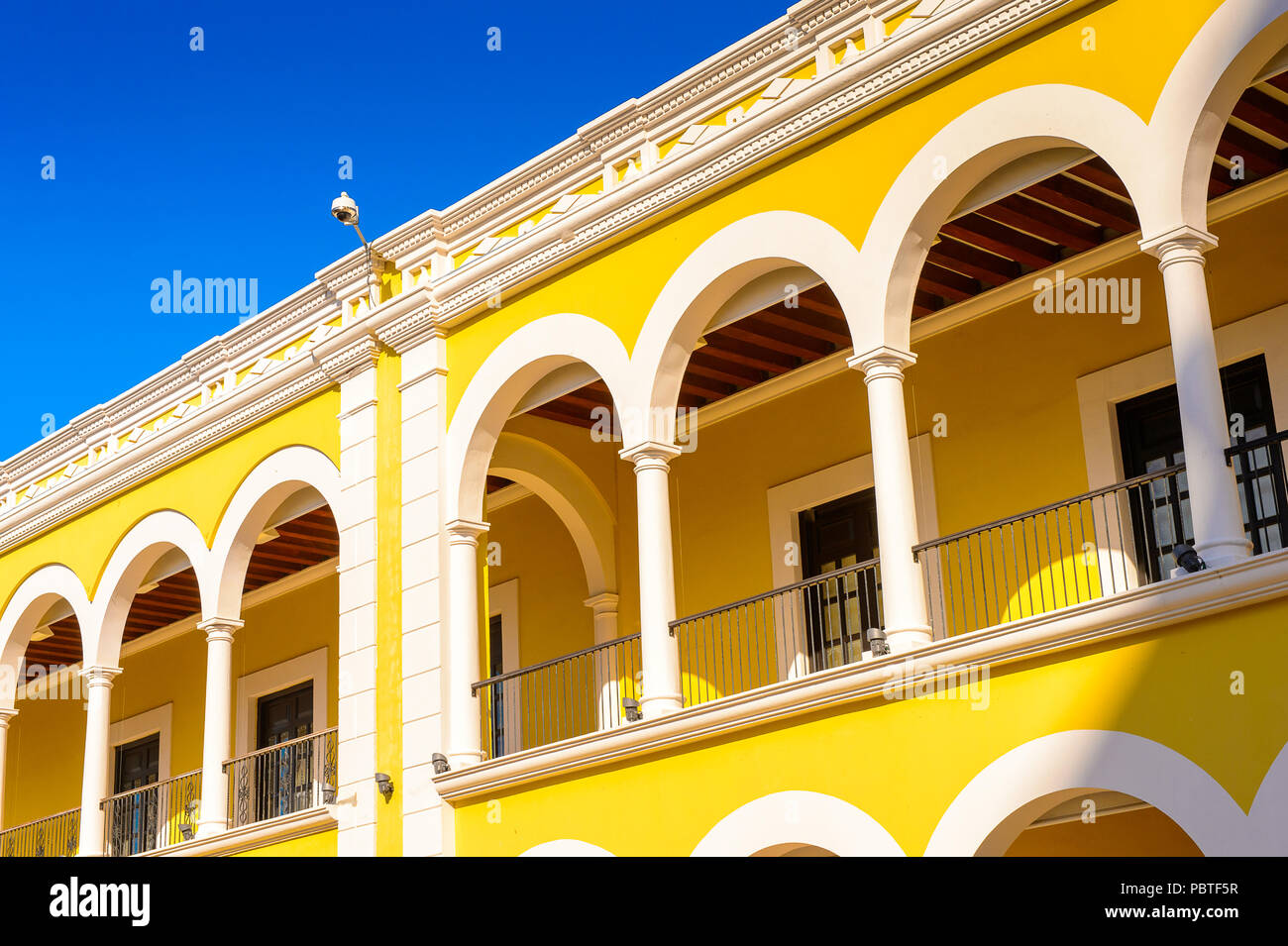 Yellow building of the main square (Zocalo) of Palenque, Mexico Stock ...