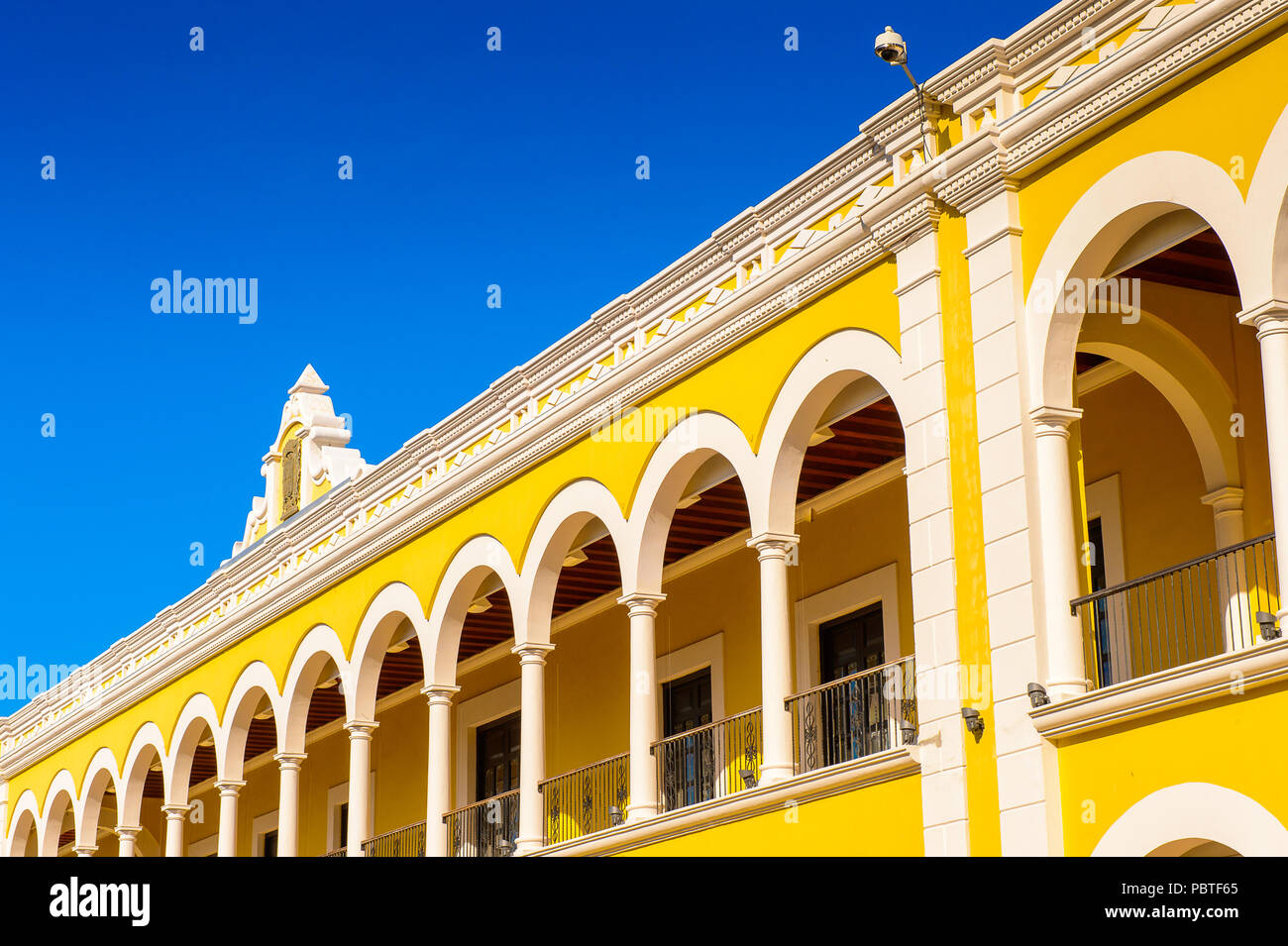 Yellow building of the main square (Zocalo) of Palenque, Mexico Stock ...