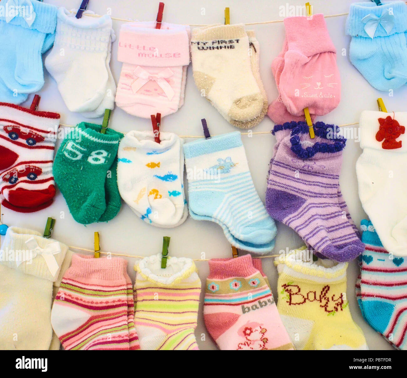 Baby clothes washing line hi-res stock photography and images - Alamy