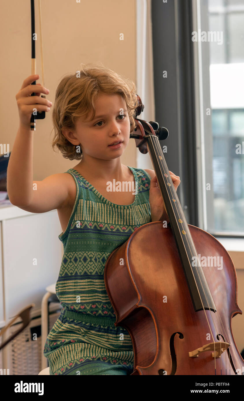 Young music student playing a cello Stock Photo - Alamy