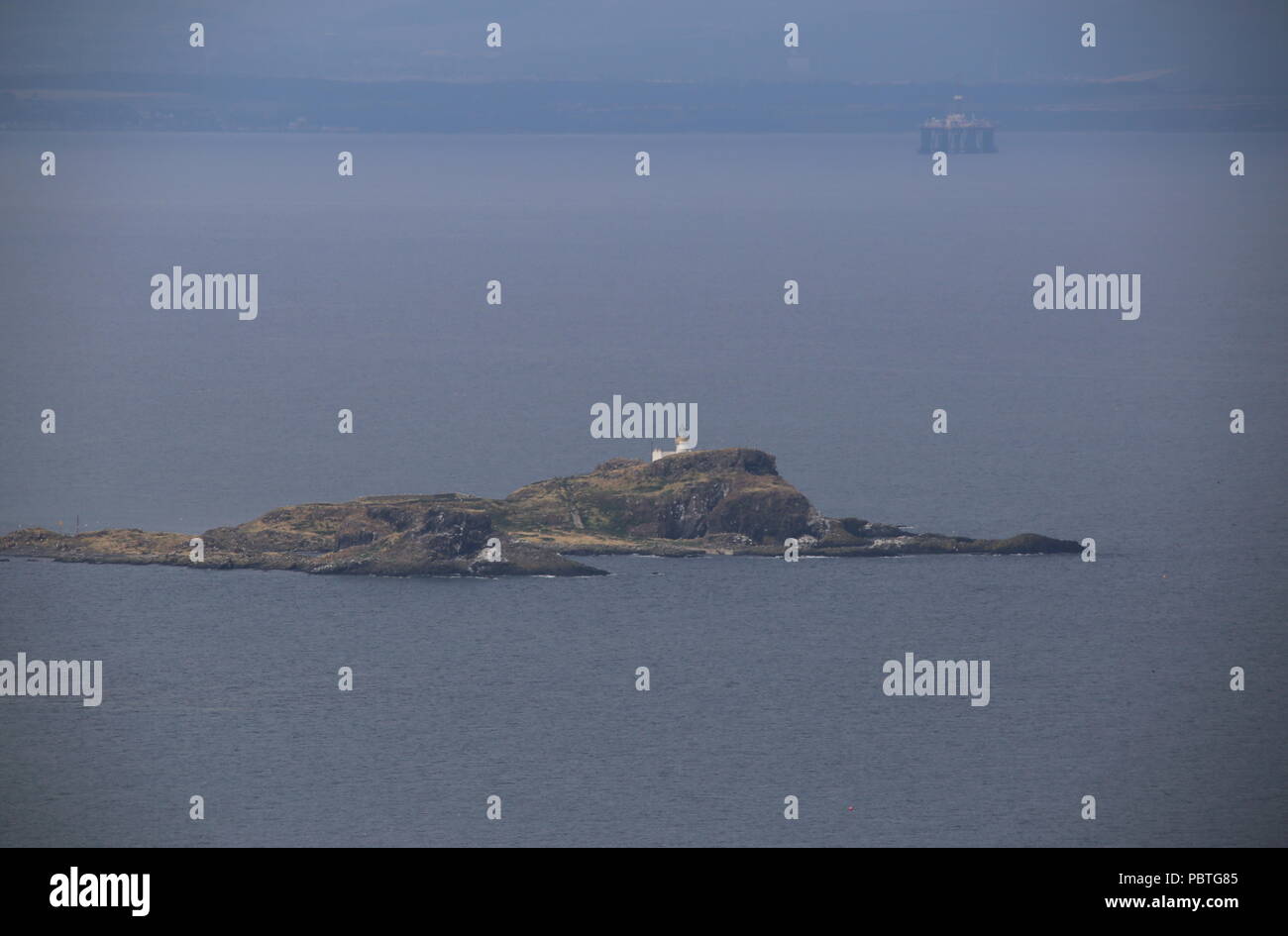 Elevated view of Fidra lighthouse on Isle of Fidra in Firth of Forth ...