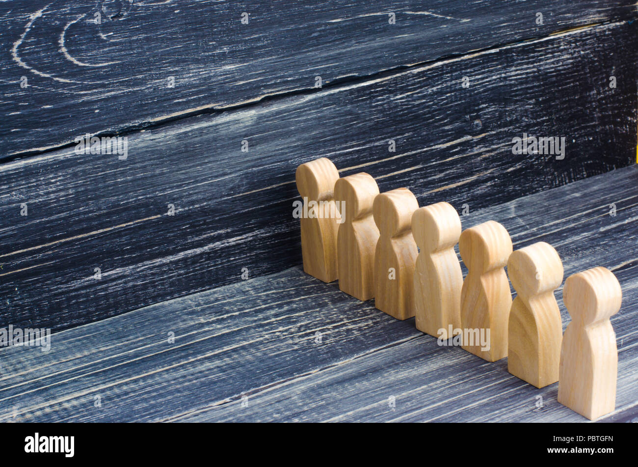 People stand in line at the briefing and wait for orders. Wooden ...
