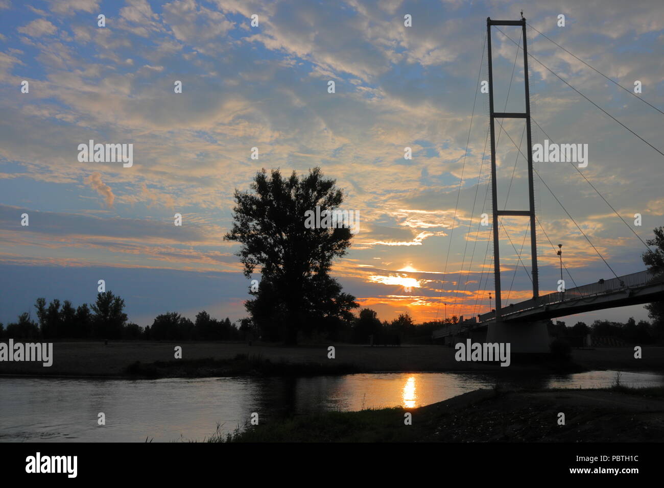River, bridge and sunrise Stock Photo - Alamy