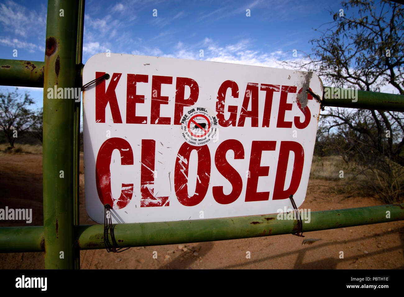 Signs opposing livestock grazing on public lands where cattle graze are ...