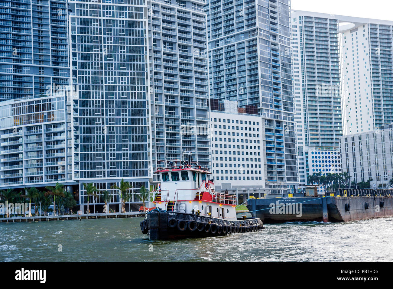Miami Florida,Miami River water,tugboat,barge,navigation,shore,skyline ...