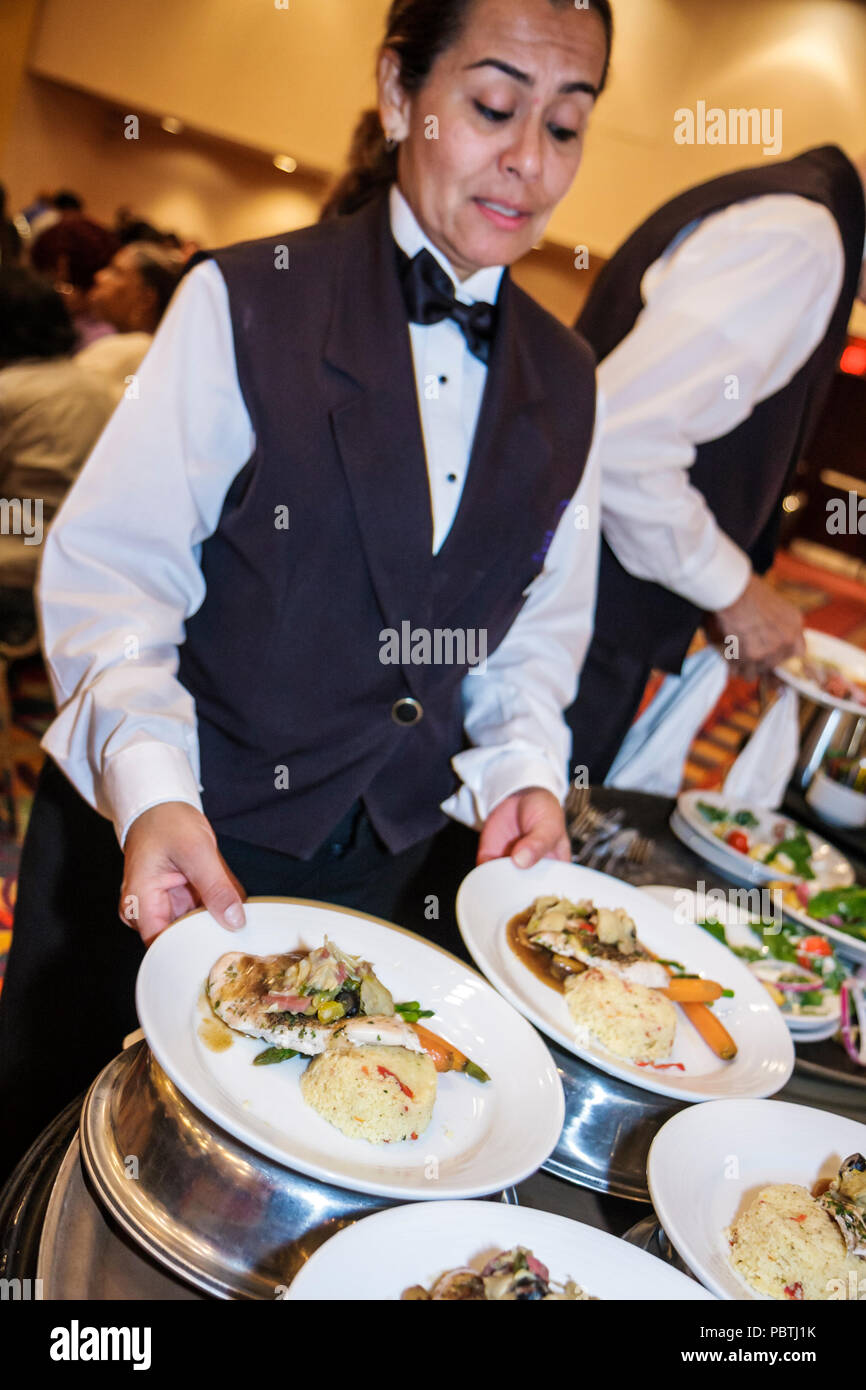 Hispanic waitress server employee interior hi-res stock photography and ...