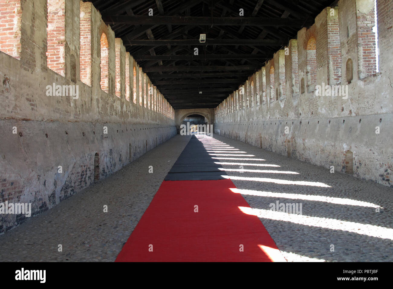 Cobbled covered walkway in Vigevano, a town and comune in the Province ...
