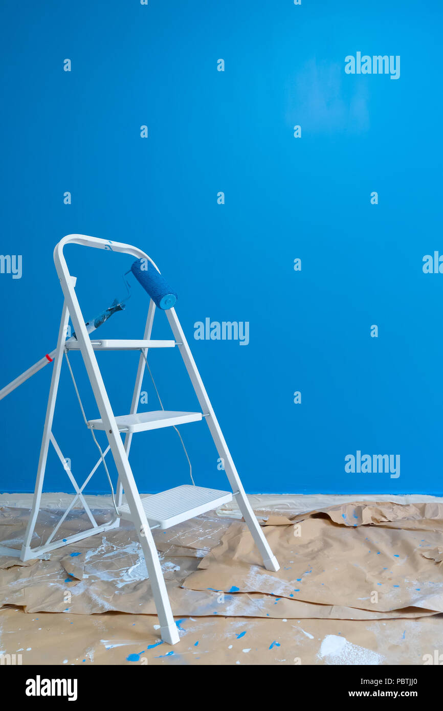 home renovation concept - old flat with ladder during restoration or ...