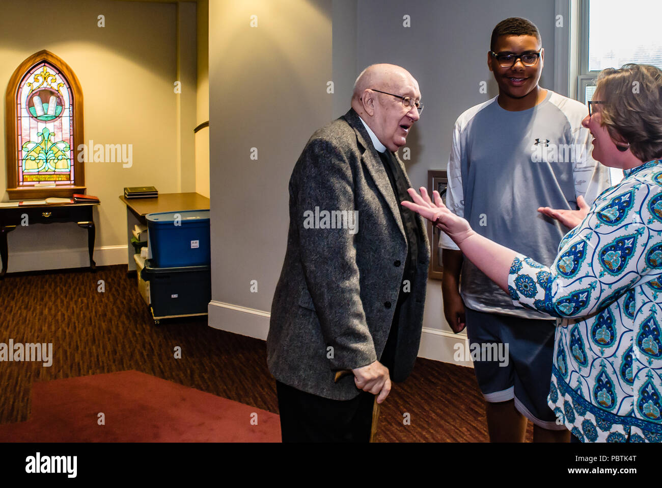 Pastor and congregational members Stock Photo - Alamy