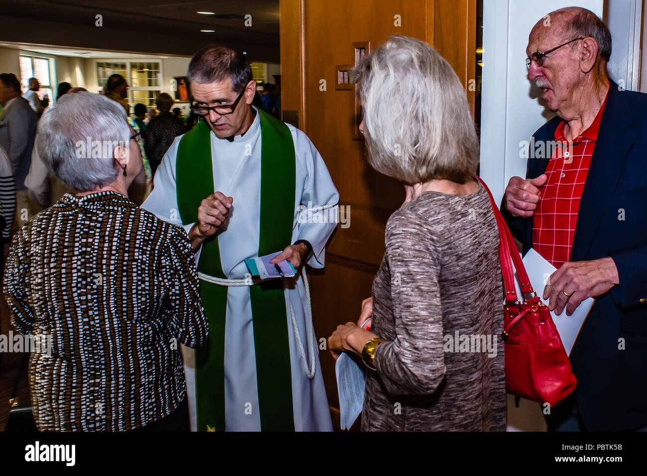Pastor and congregational members Stock Photo - Alamy