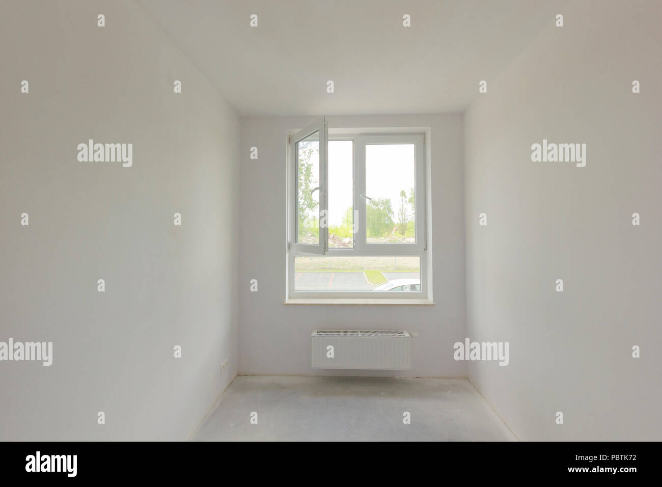 Empty unfinished room with window in a new constructed building Stock ...