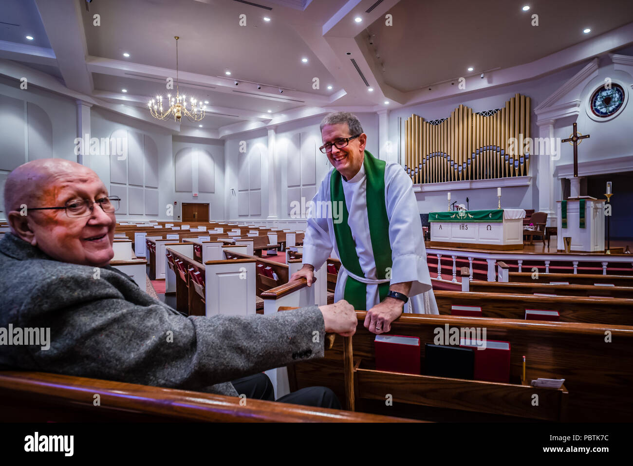 Pastor and congregational members Stock Photo - Alamy