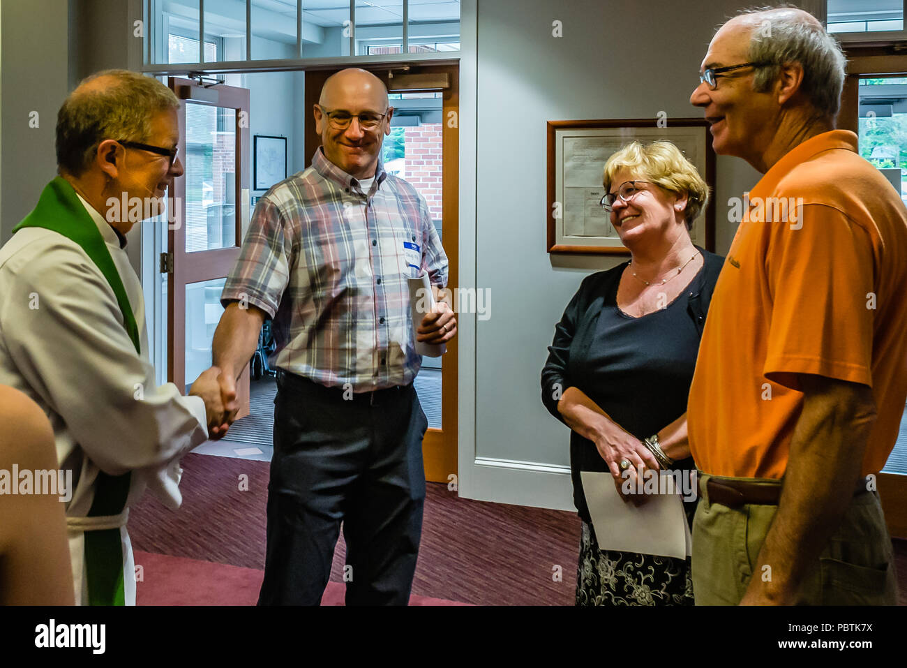 Pastor and congregational members Stock Photo - Alamy