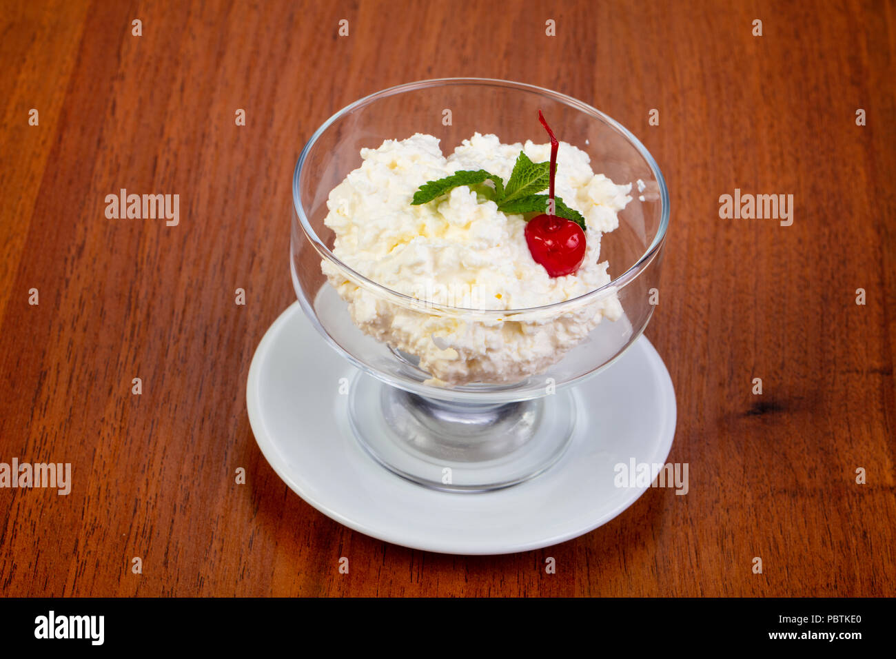 Tasty cottage cheese with cherry Stock Photo - Alamy