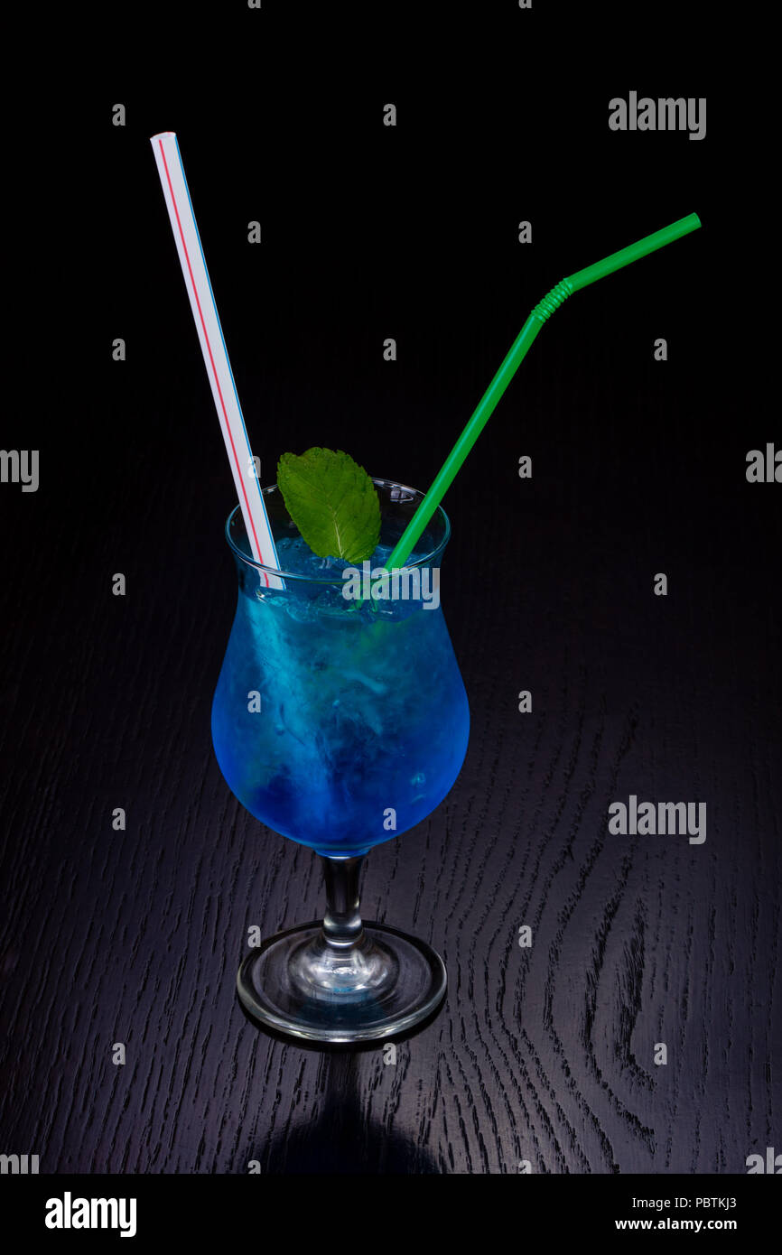Sweet blue curacao cocktail with mint Stock Photo - Alamy