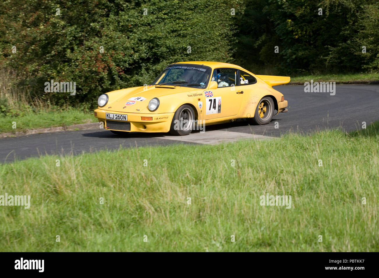 September 2008 - Bright yellow Porsche 911 competing on a special stage ...