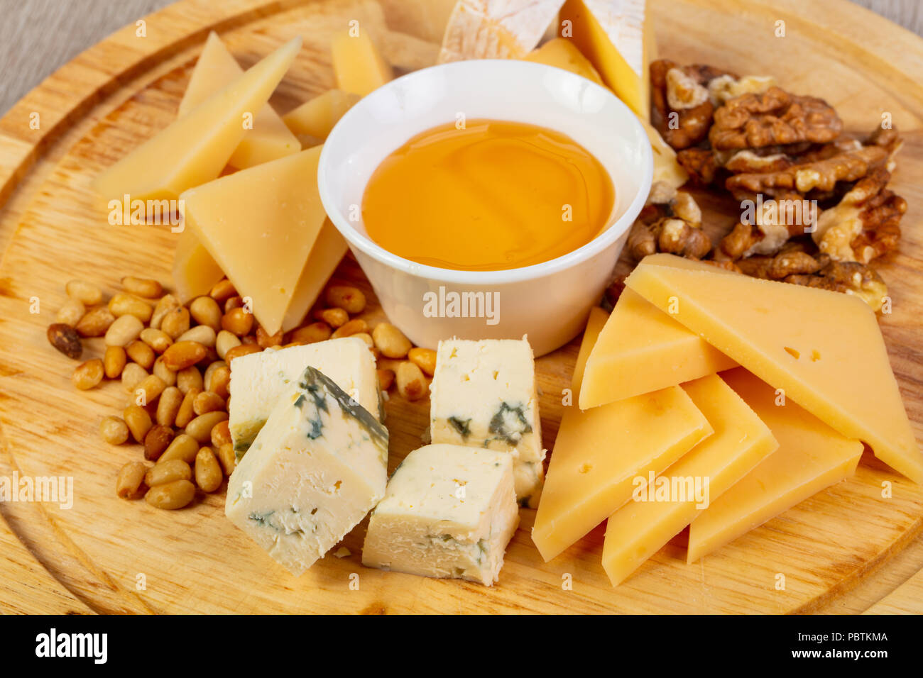 Cheese plate mix with honey Stock Photo - Alamy
