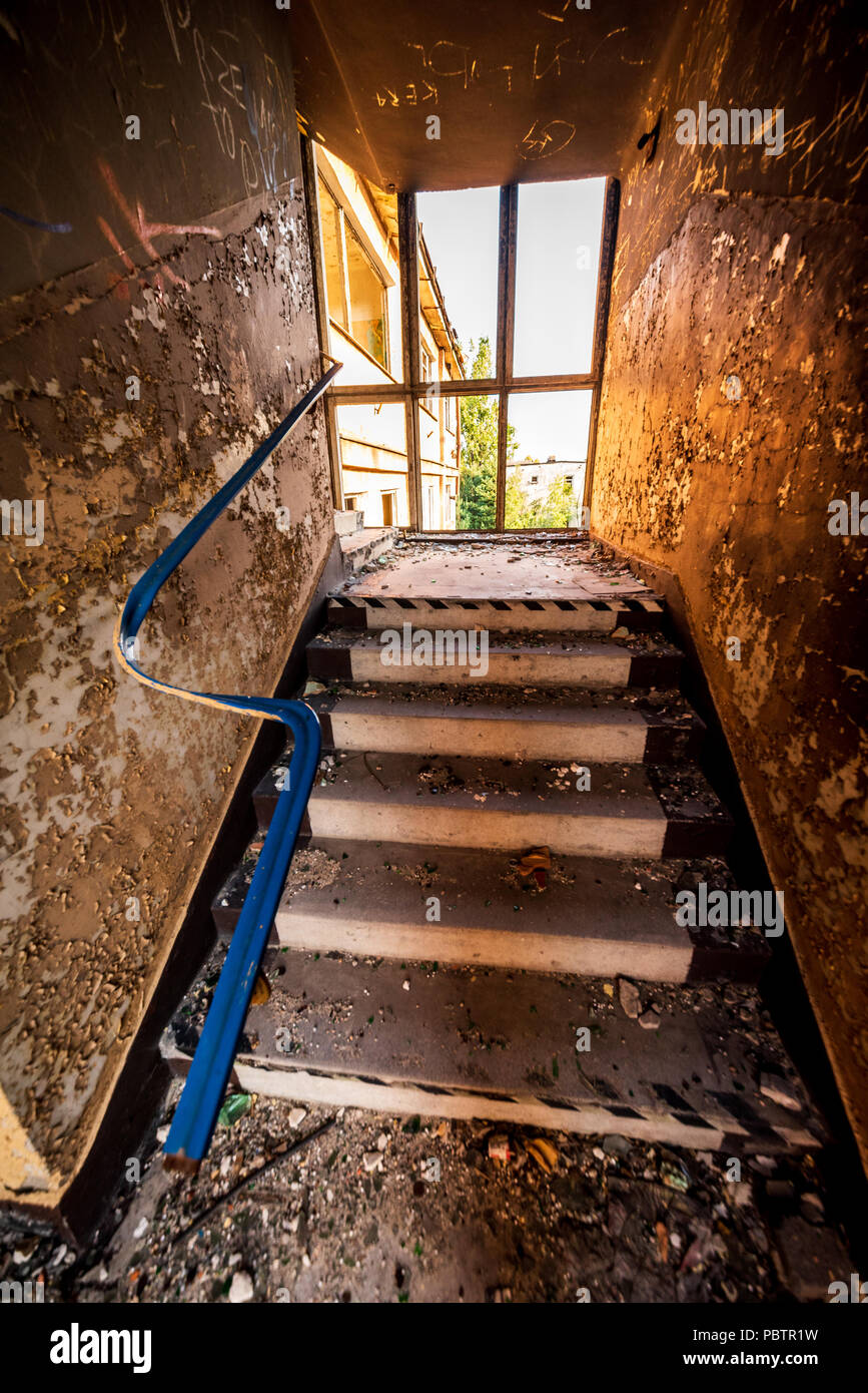 Abandoned building indoors, decaying and falling apart. Sunlight ...