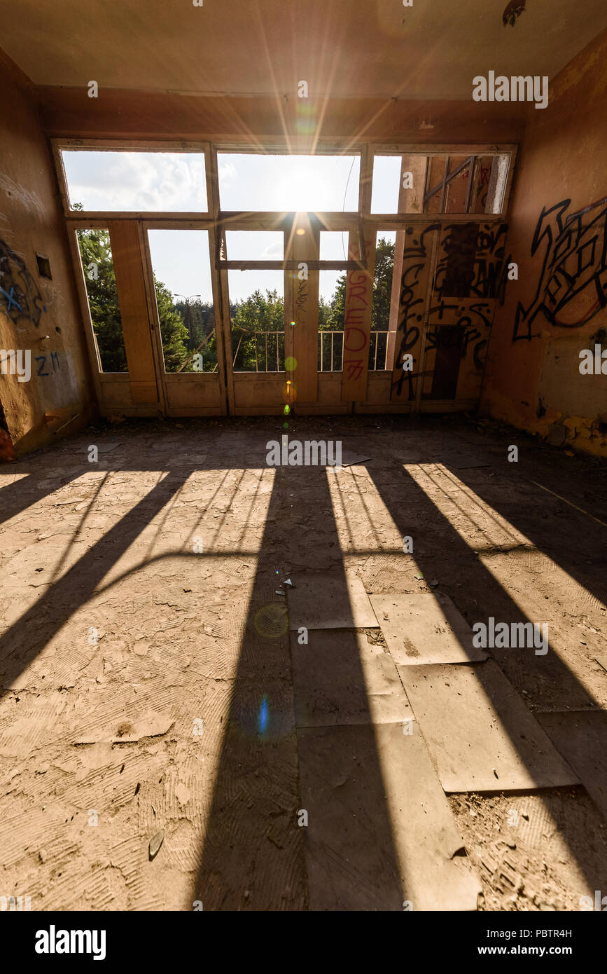Abandoned building indoors, decaying and falling apart. Sunlight ...