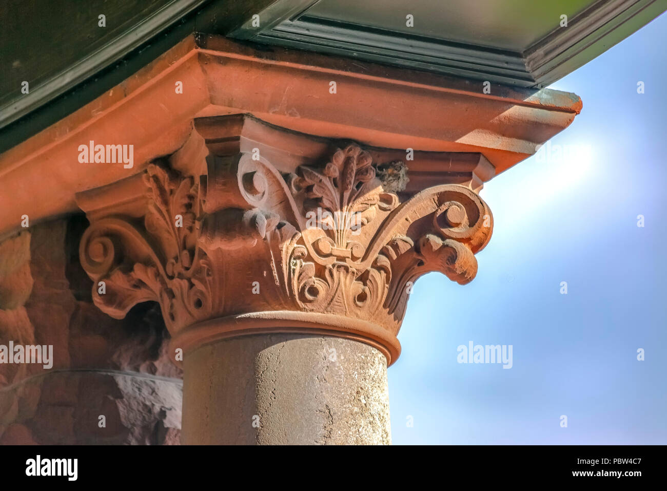 Upper portion of pillar on a historic building Stock Photo - Alamy