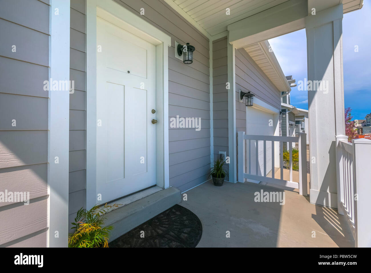 White front door with patio area Stock Photo - Alamy