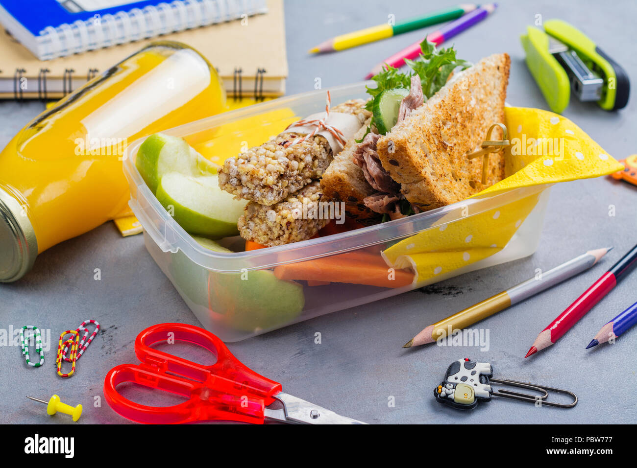Lunch box and school supplies Stock Photo - Alamy